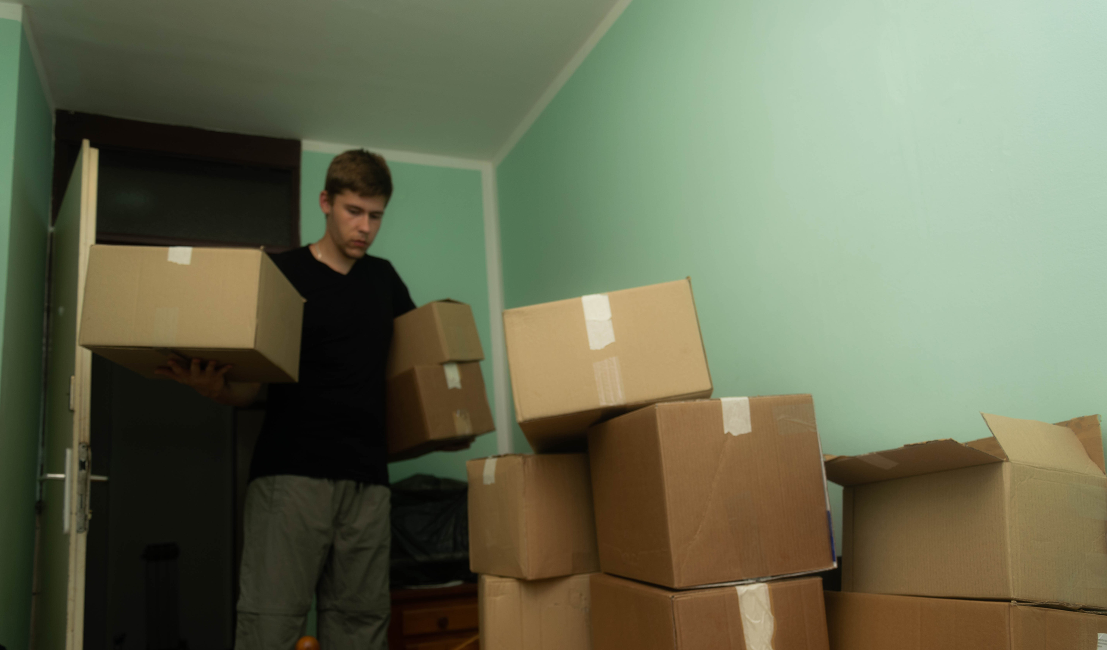 Student moving in to his dorm, starting his student life, entering his ...